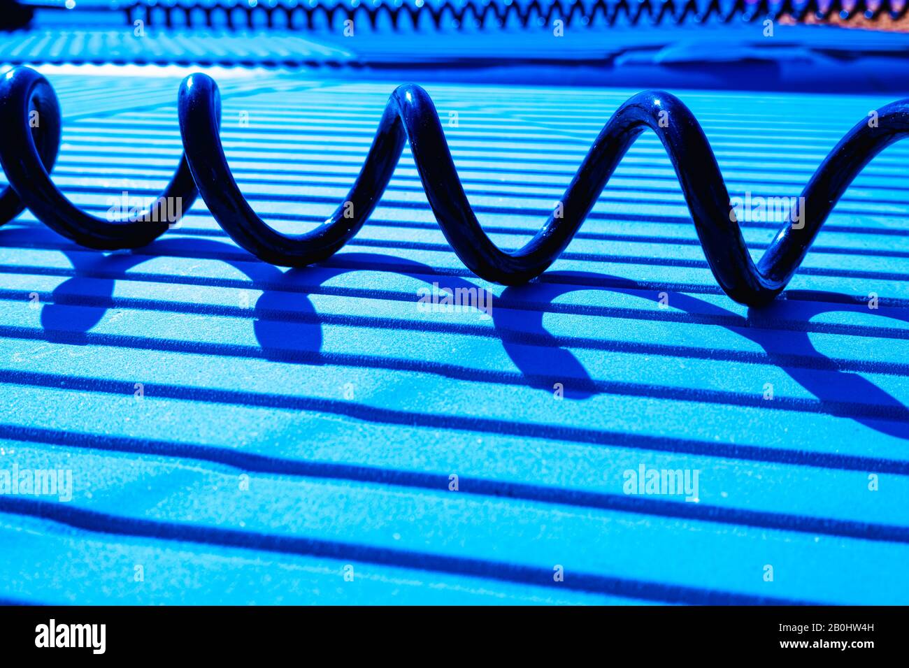 Wavy cable on a solid colored foam background Stock Photo - Alamy