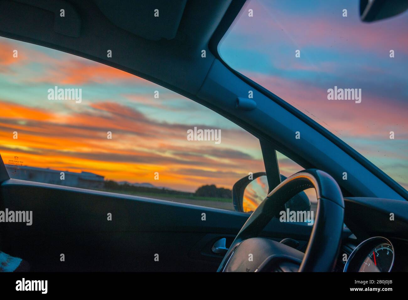 Sunset viewed from inside a car Stock Photo - Alamy