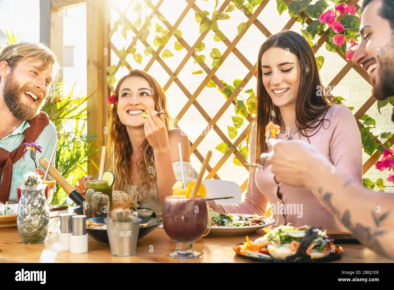 Happy friends lunching healthy food in brunch bar restaurant - Young ...