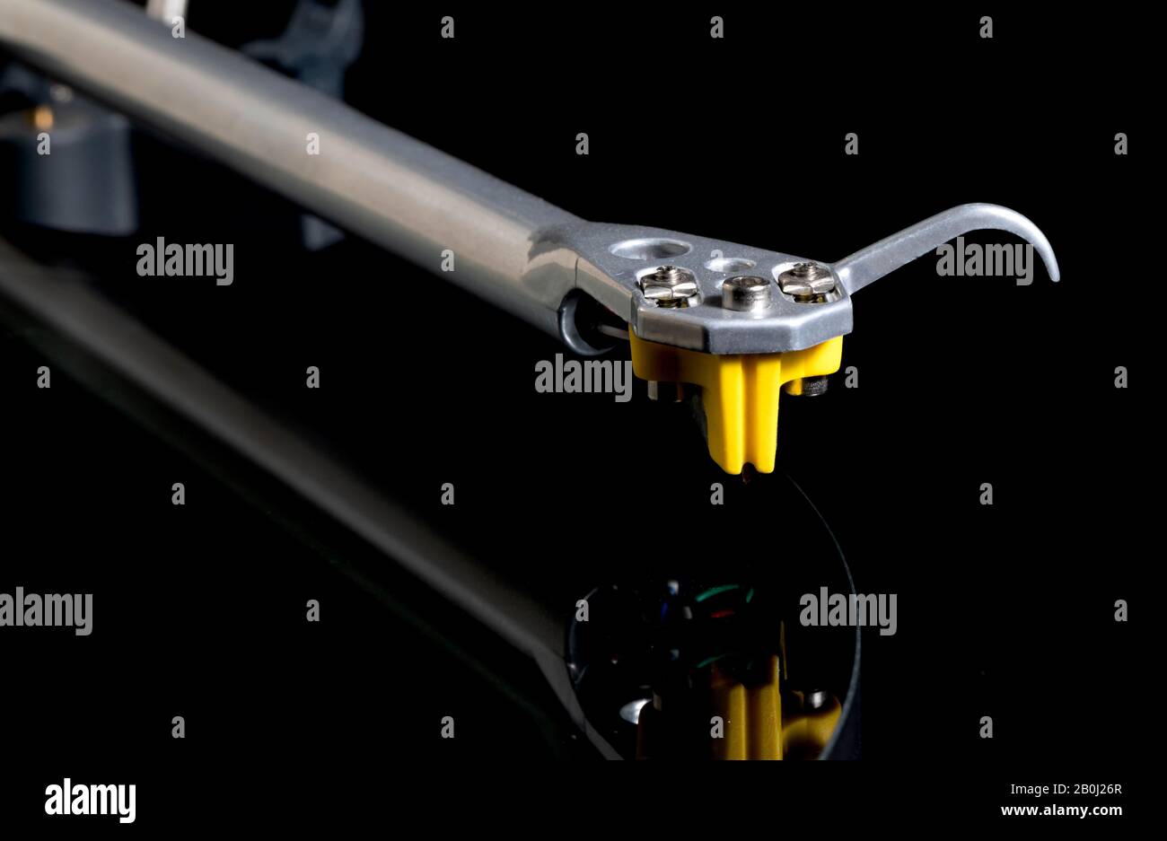 Turntable arm closeup on black background Stock Photo - Alamy