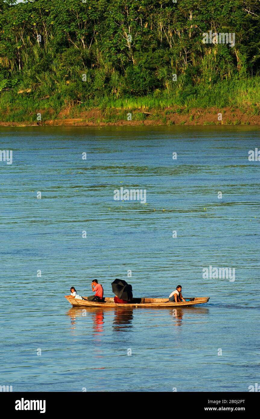 PERU, AMAZON RIVER, LOCAL PEOPLE IN CANOE Stock Photo - Alamy