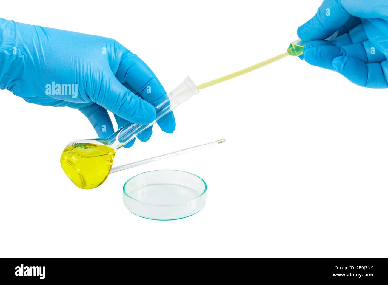Hands in gloves take a sample from a test tube Stock Photo - Alamy