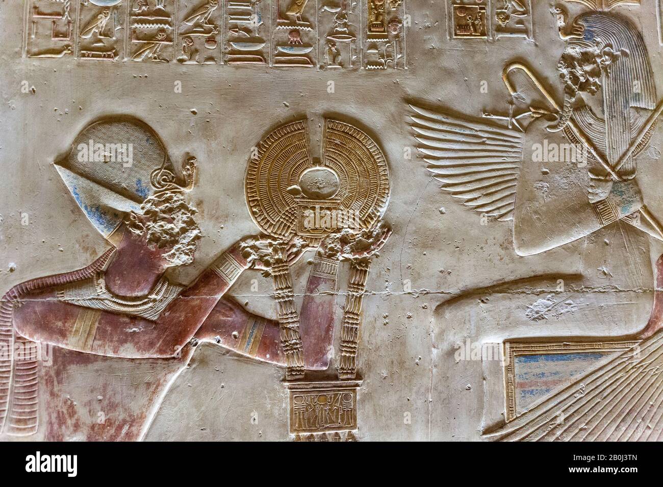 Bas-relief wall carving depicting King Seti I presenting a golden ...