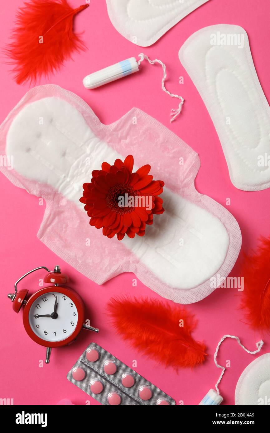 Menstrual period concept on pink background, top view Stock Photo - Alamy