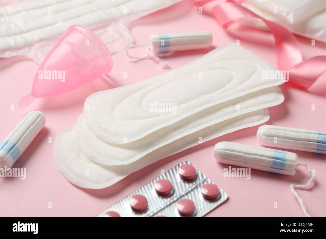 Menstruation period accessories on pink background, close up Stock ...