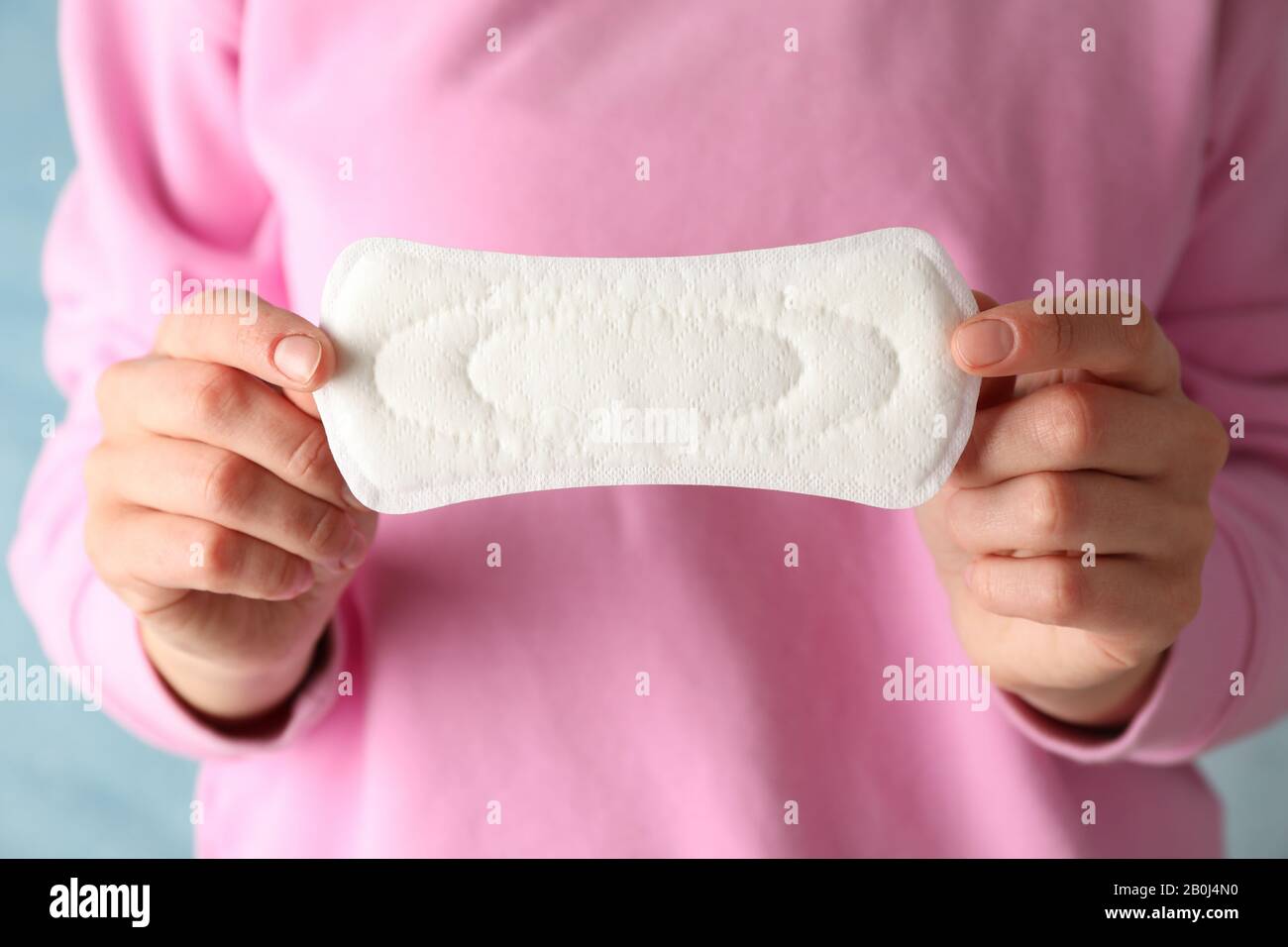 Woman holding period pad hi-res stock photography and images - Alamy