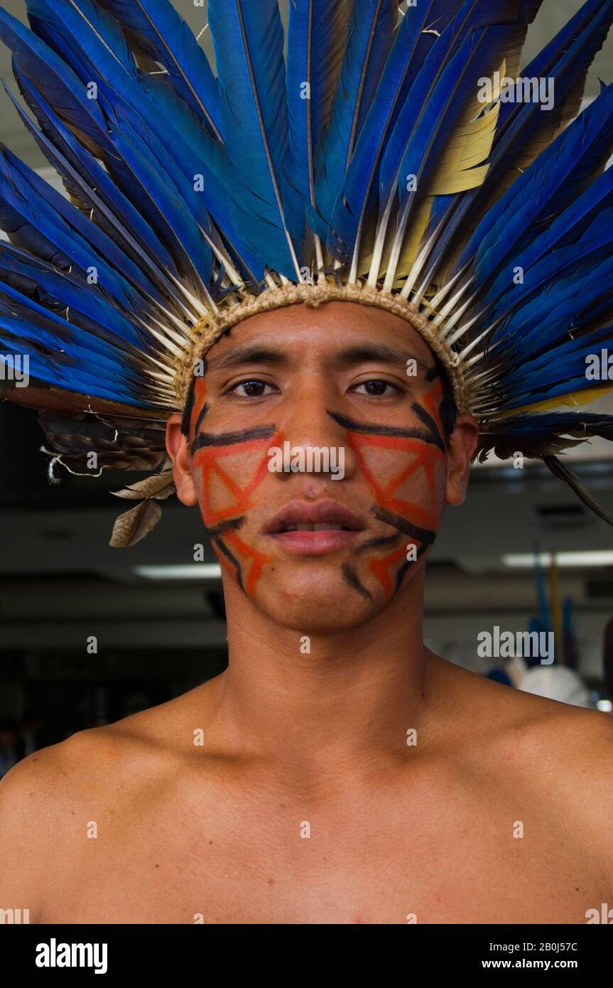 BRAZIL, MATO GROSSO, PORTRAIT OF NATIVE INDIAN MAN WITH MACAW FEATHER ...