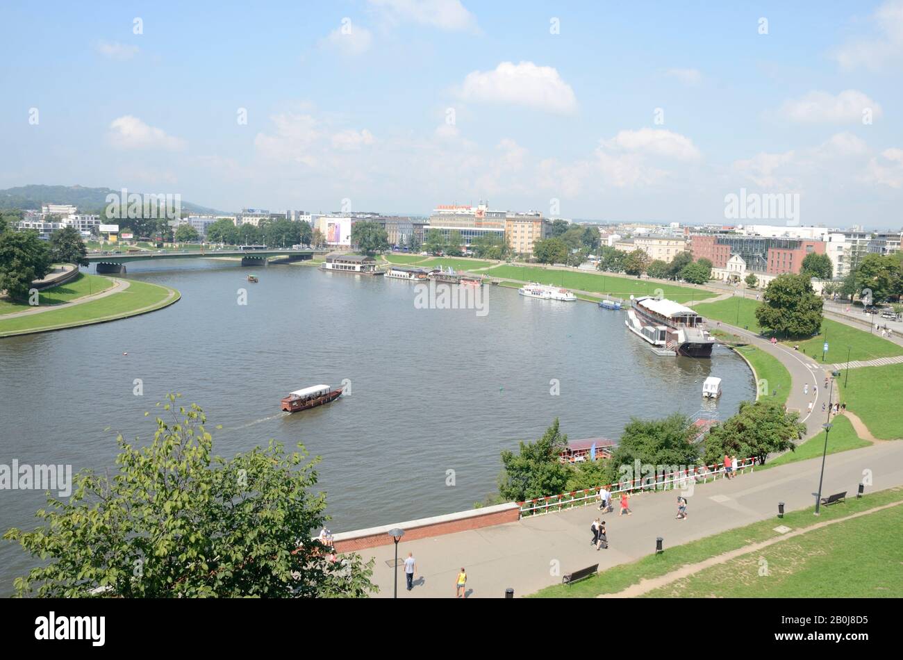 Krakow, Poland - July 27, 2018: People at the riverfront seen from the ...
