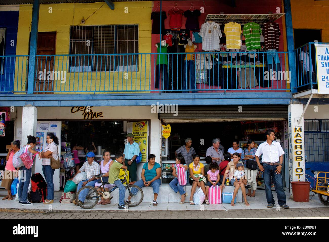 COSTA RICA, TOWN OF UPALA, STREET SCENE, BUS STATION, PEOPLE WAITING ...