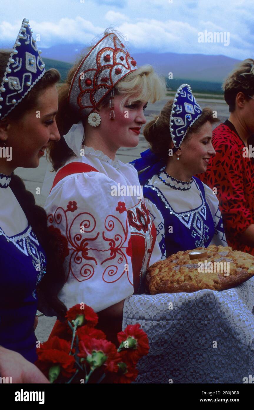 RUSSIA, MAGADAN,TRADITIONAL WELCOME CEREMONY, WOMEN SERVING BREAD ...