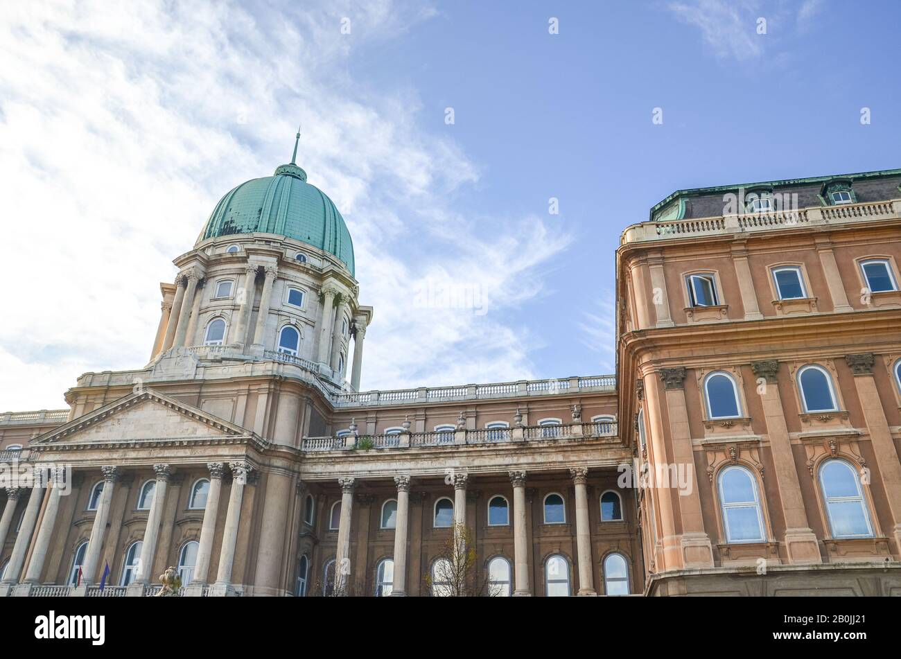 Buda Castle in Budapest, Hungary with light blue sky and clouds above ...