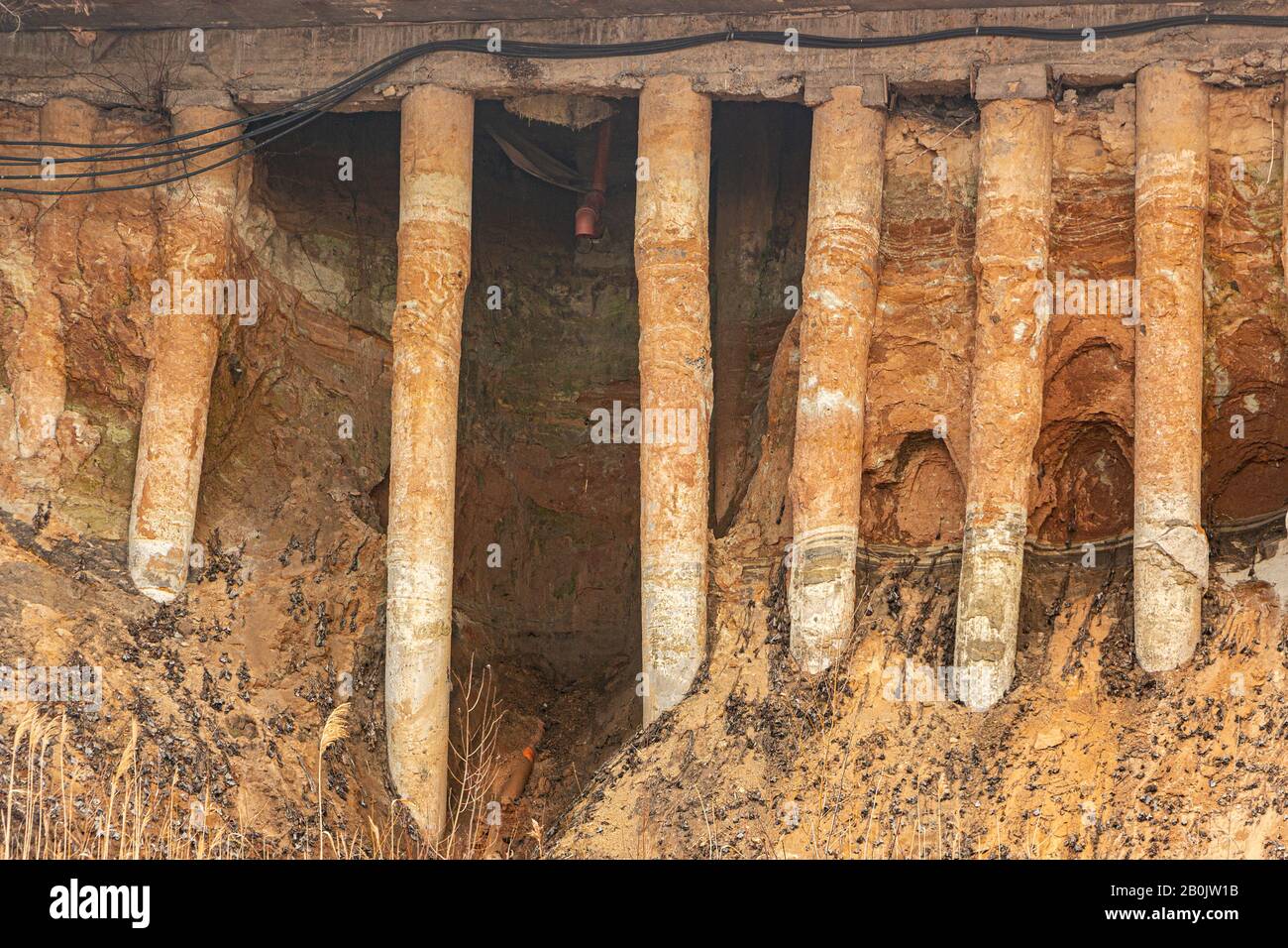 Landfall on the construction site. Due to water erosion Stock Photo - Alamy