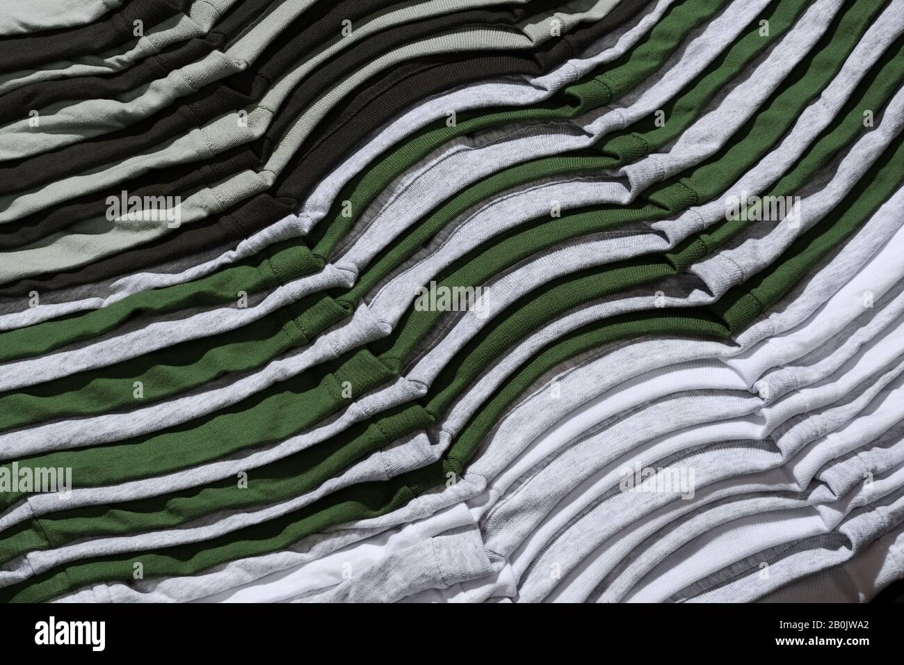 T-shirts shirt color line stack cotton textiles Stock Photo - Alamy