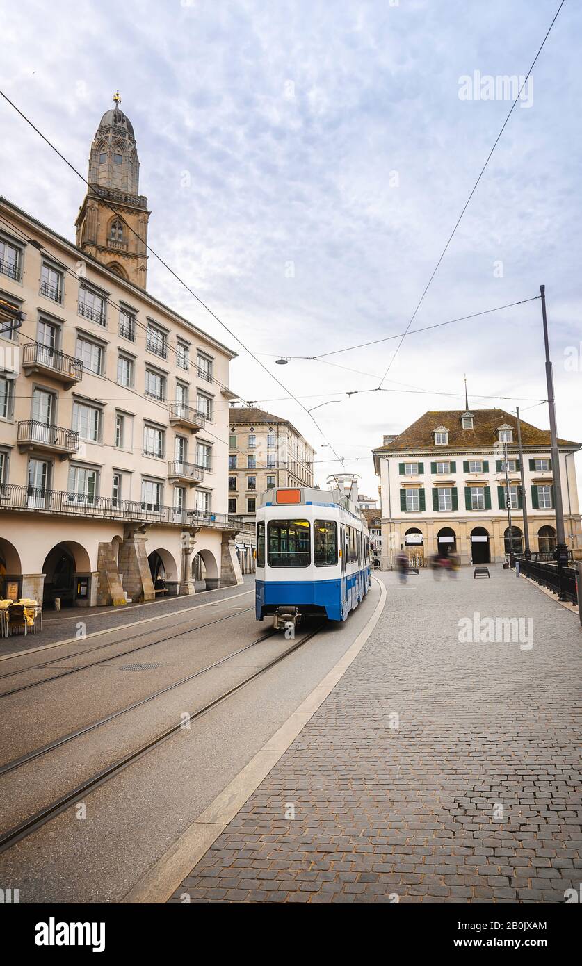 Zurich old city center and means of transportation. Blue tram on ...