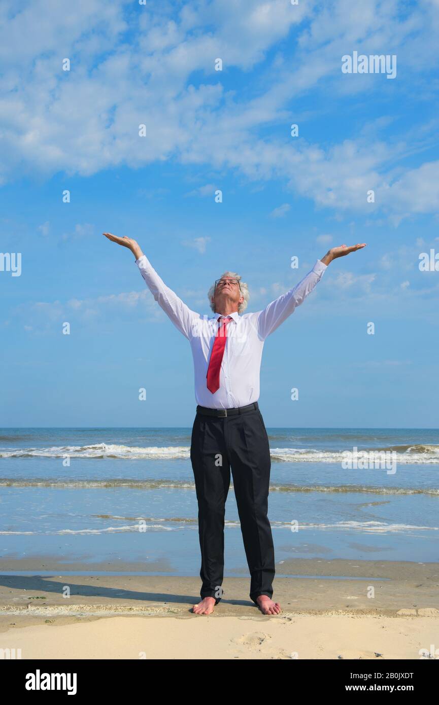 Business man in formal suit zen meditation at the beach Stock Photo - Alamy