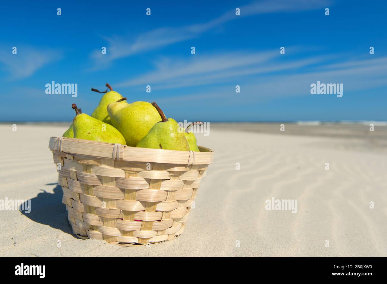 Basket fresh pears at the beach Stock Photo - Alamy