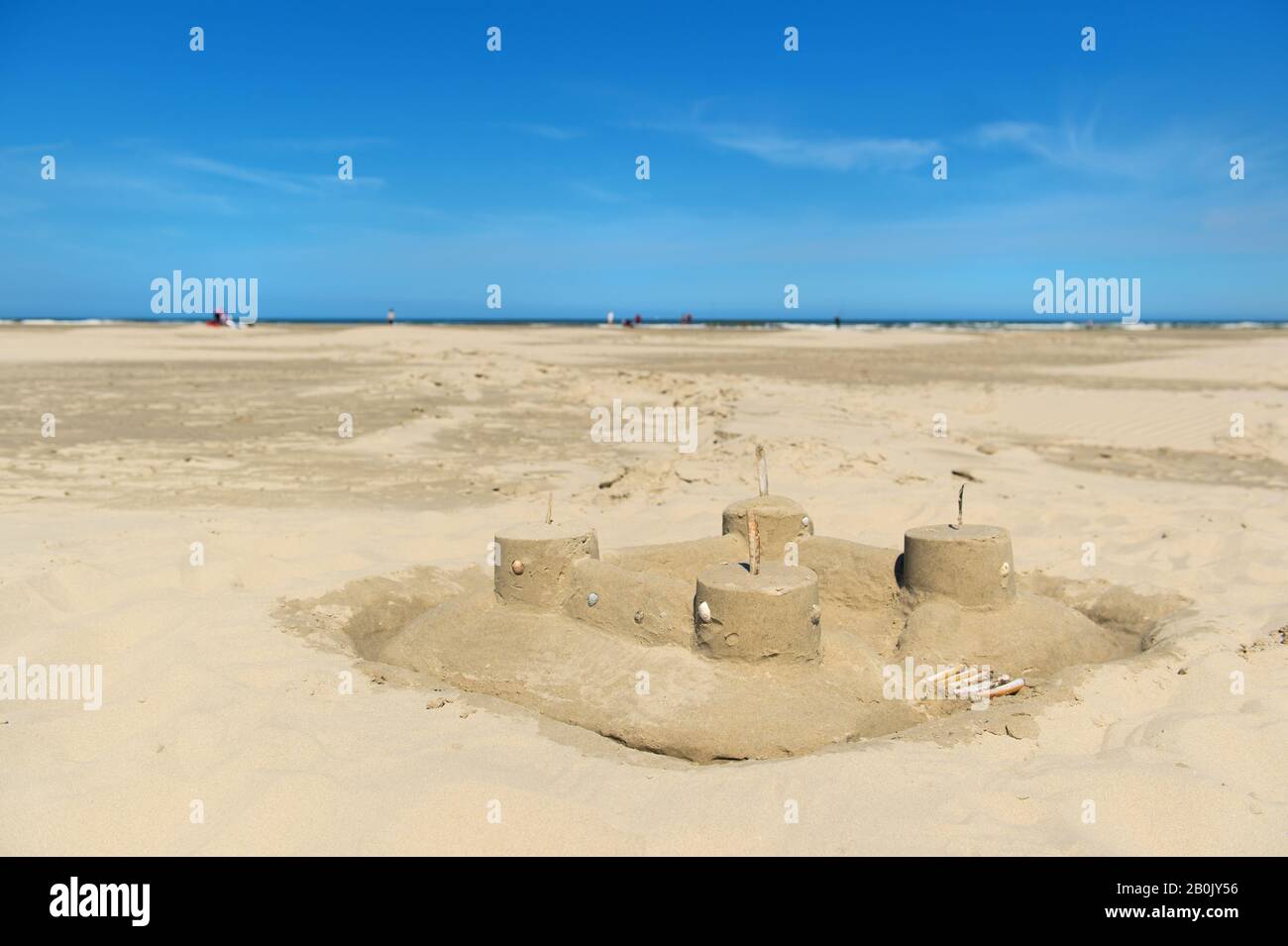 Sand castle with shells at the beach Stock Photo - Alamy