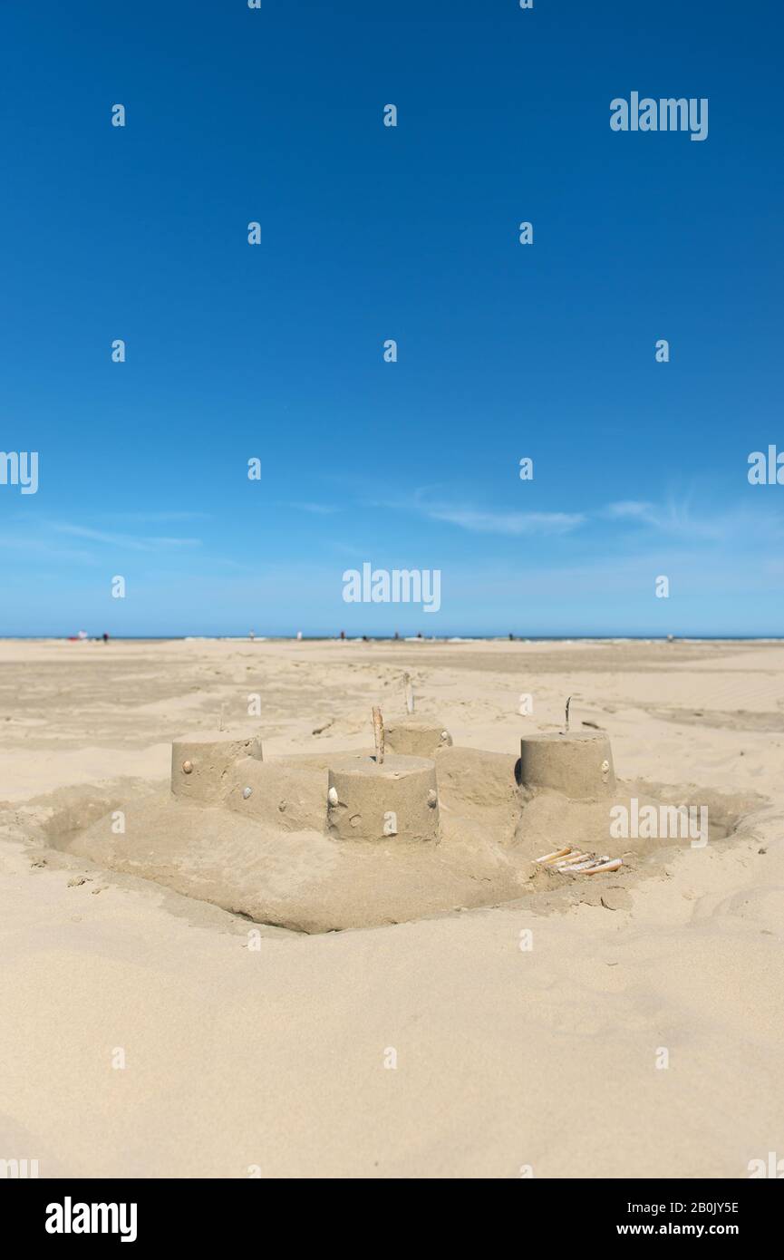 Sand castle with shells at the beach Stock Photo - Alamy