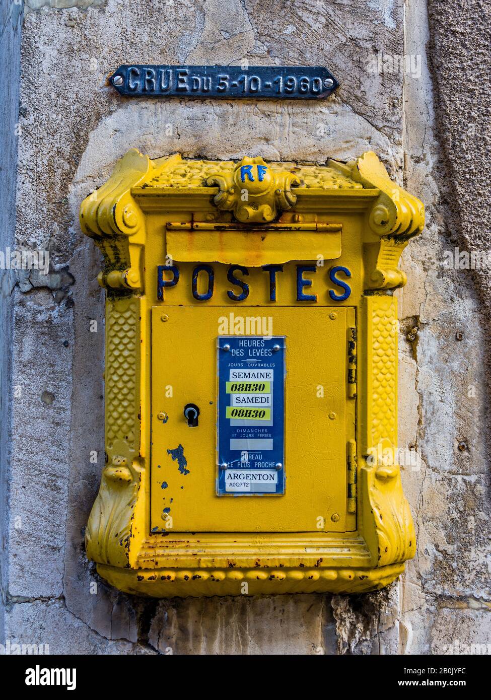 Old French "La Poste" postbox with plaque above marking height of 1960 ...
