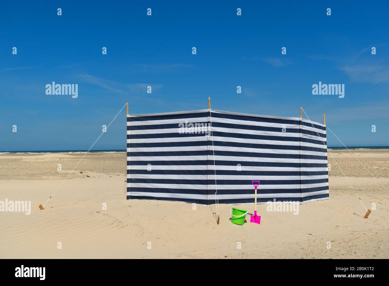 Striped wind break at the beach Stock Photo - Alamy