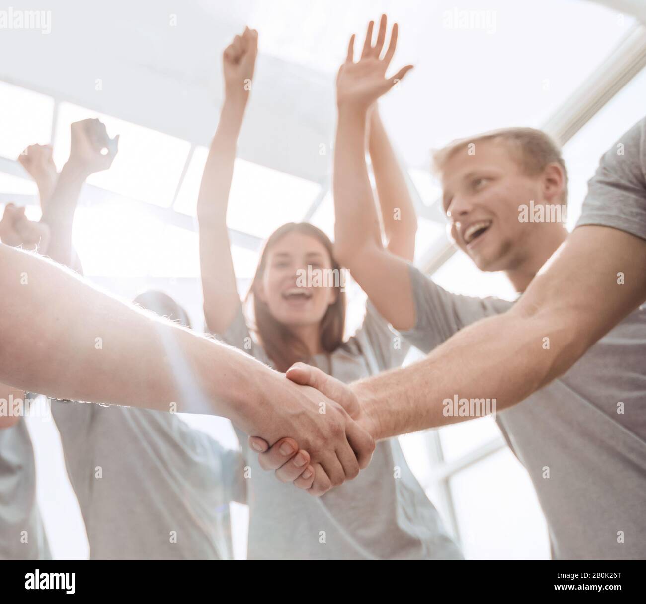 young people congratulating each other on the victory Stock Photo - Alamy