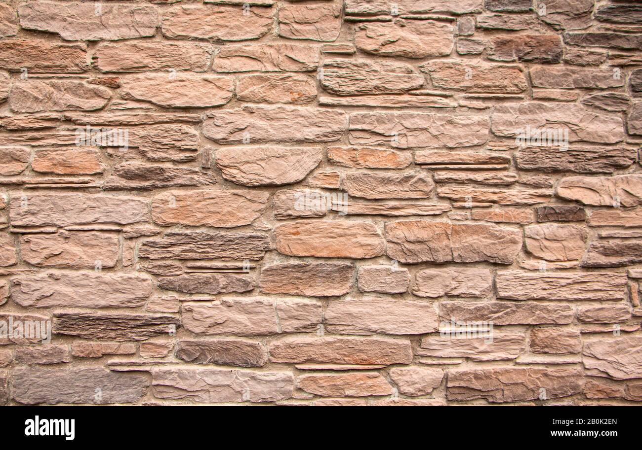 Texture of stone wall, square yellow travertine tile Stock Photo - Alamy