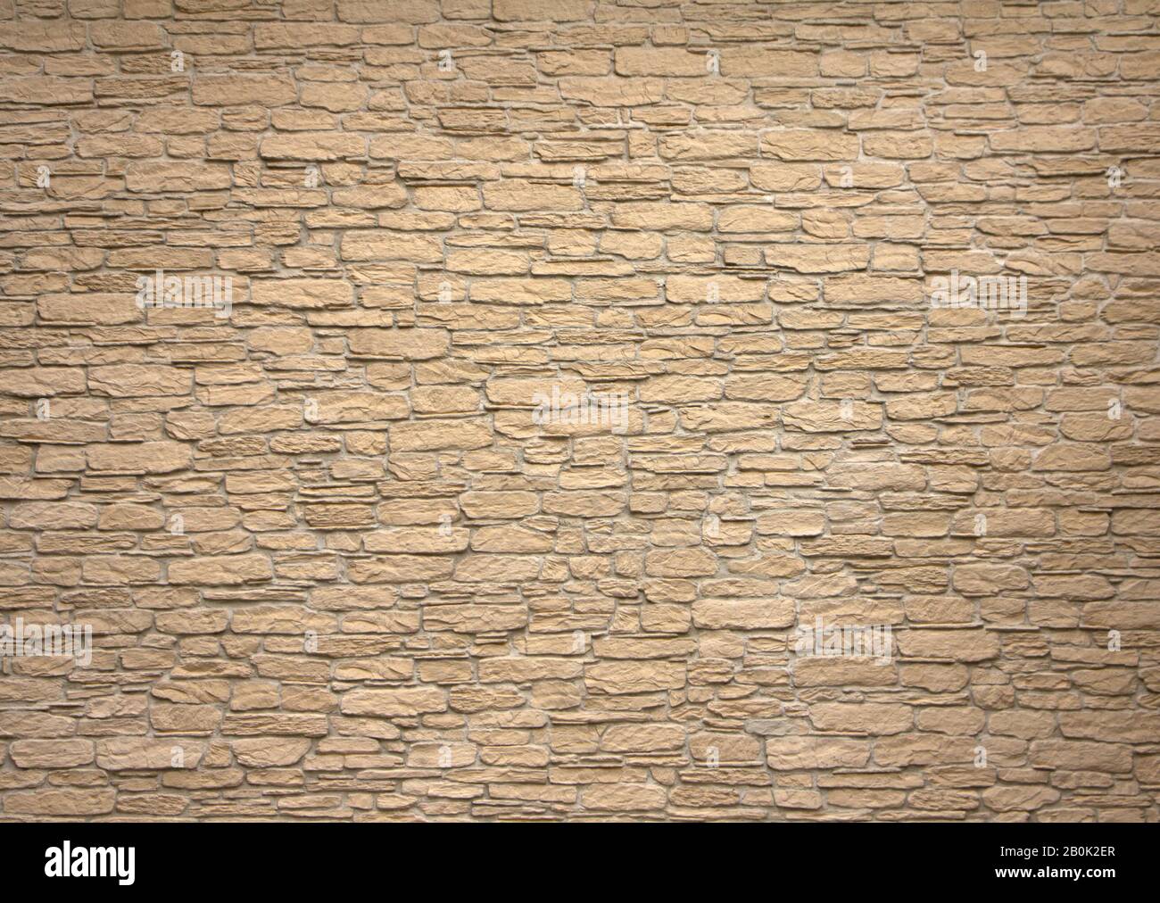 Texture of stone wall, square yellow travertine tile Stock Photo - Alamy