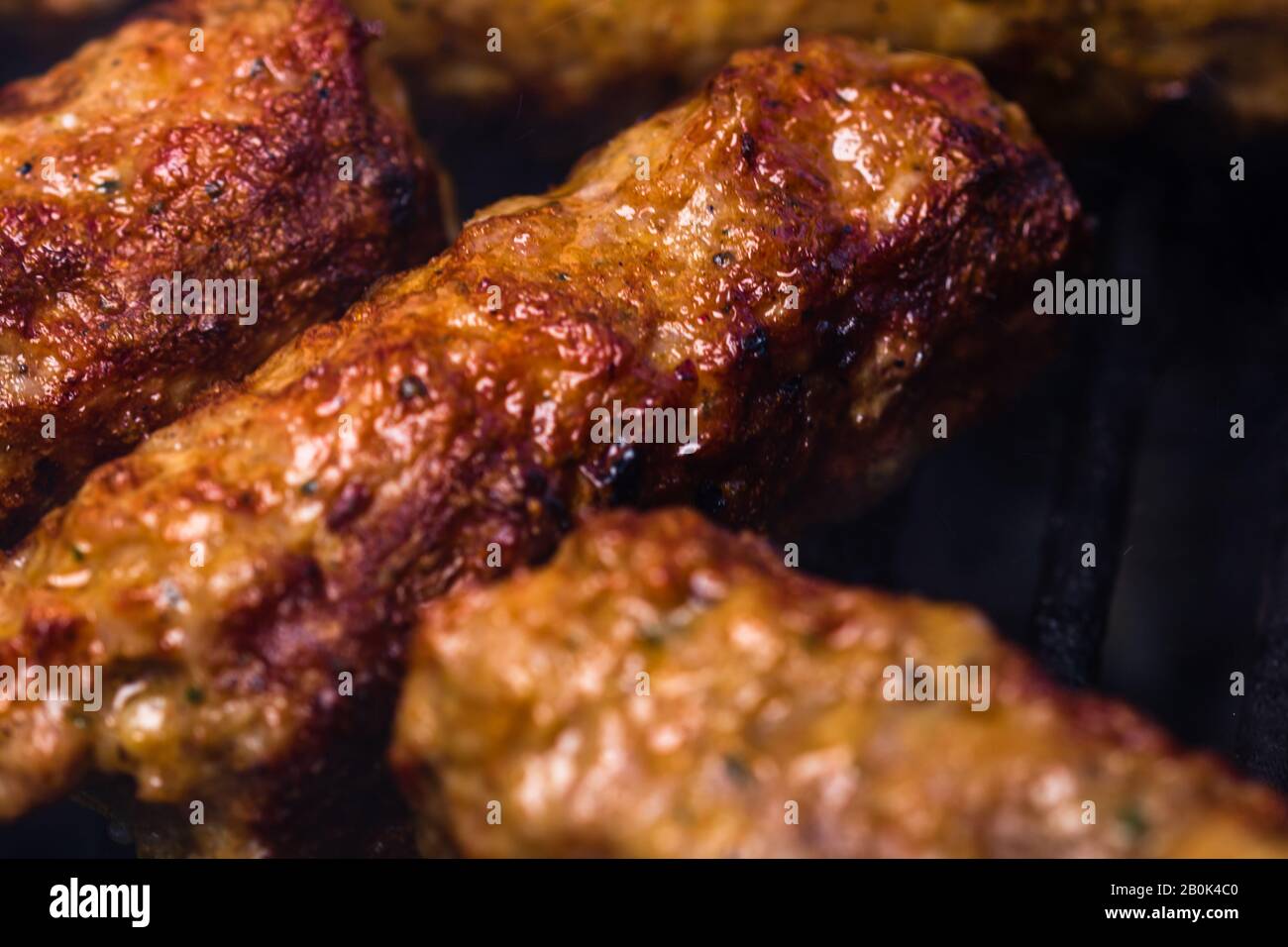 Traditional Romanian food Meat Balls "mici" on grill. Tasty meat balls ...