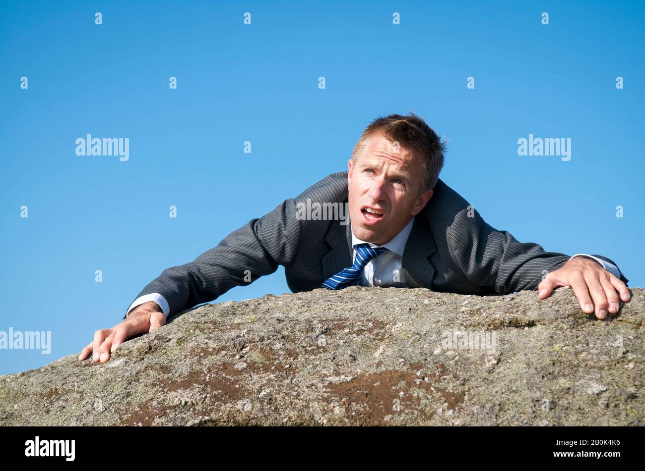 Businessman climbing mountain hi-res stock photography and images - Alamy