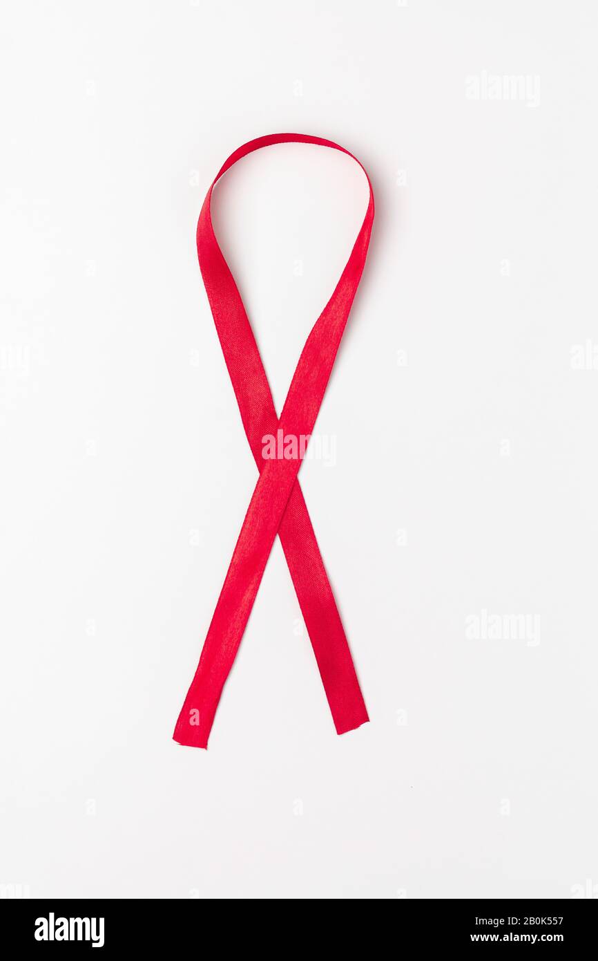 AIDS red ribbon on a white background Stock Photo - Alamy
