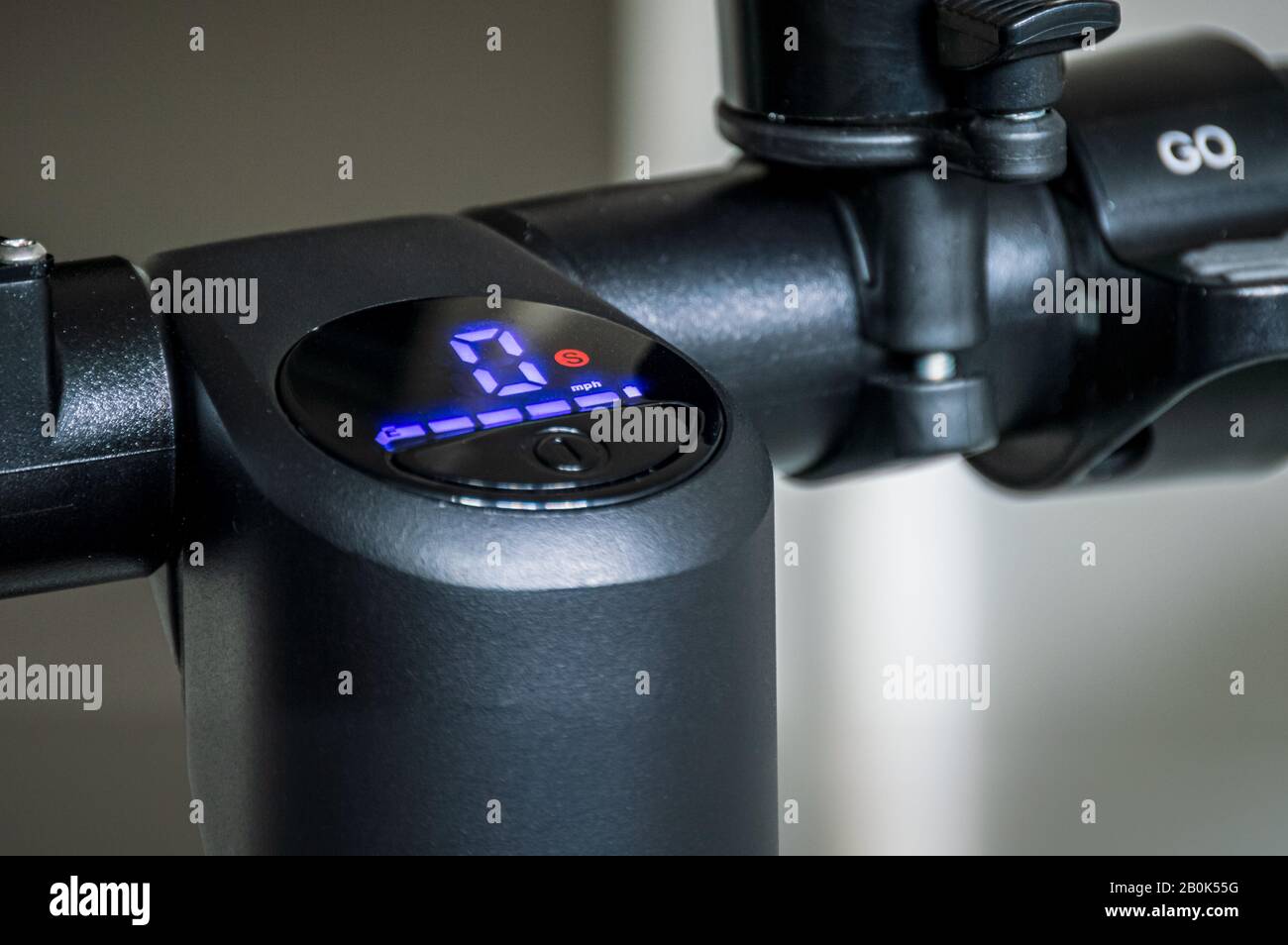 Close up display screen and power button on electric scooter handlebar ...