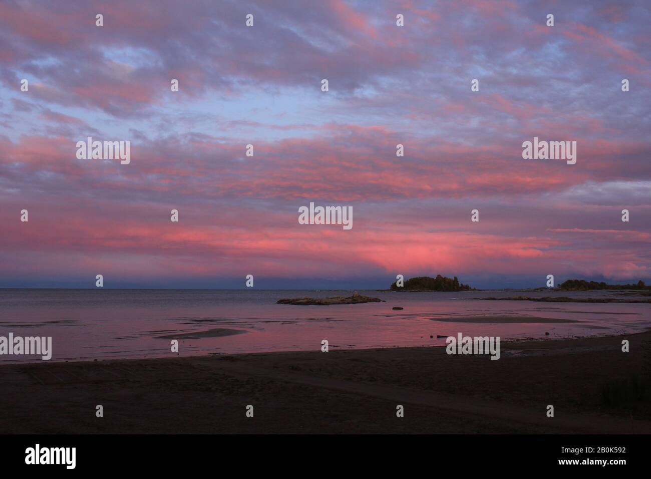 Pink clouds over Lake Vanern, summer sunset in Sweden Stock Photo - Alamy