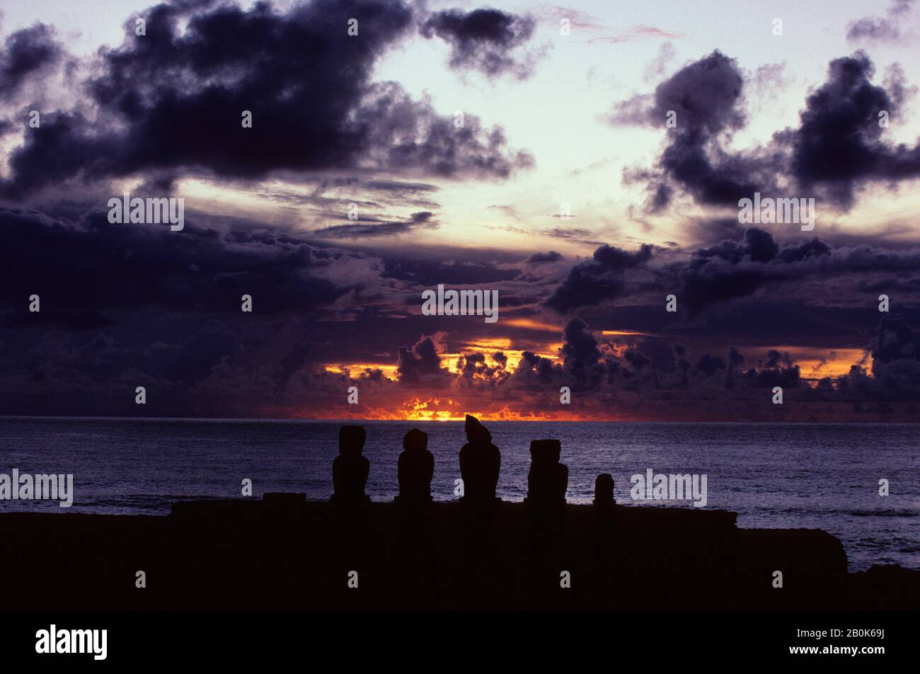 EASTER ISLAND, AHU TAHAI, MOAI STATUES WITH DRAMATIC CLOUDS AT SUNSET ...
