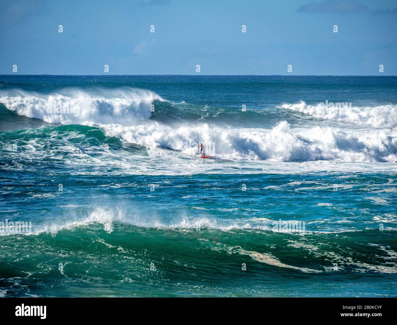 Surfers enjoying big waves in hi-res stock photography and images - Alamy
