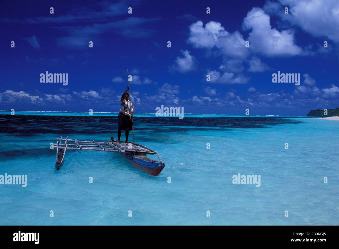 FIJI, LAU GROUP, FULANGA ISLAND, BEACH, MAN IN OUTRIGGER CANOE Stock ...