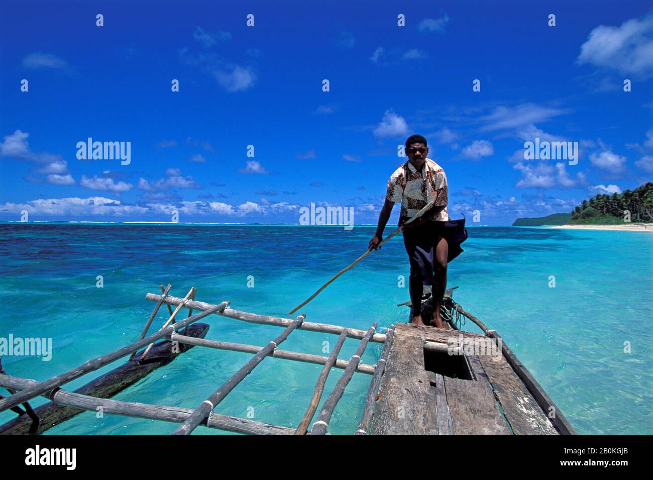 FIJI, LAU GROUP, FULANGA ISLAND, BEACH, MAN IN OUTRIGGER CANOE Stock ...