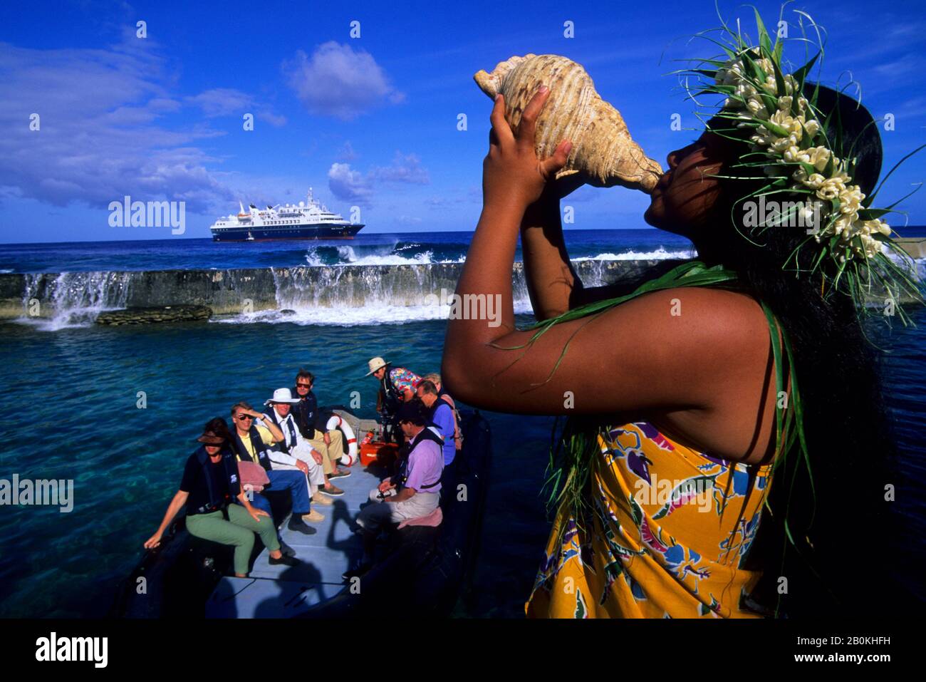 Island woman blowing conch shell hi-res stock photography and images ...