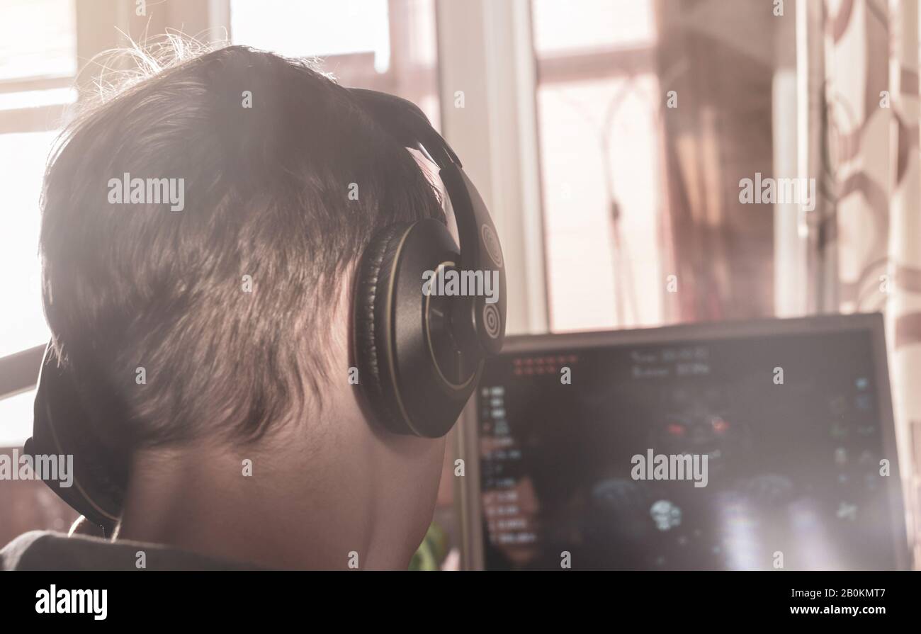 Boy with headphones, view from back Stock Photo - Alamy