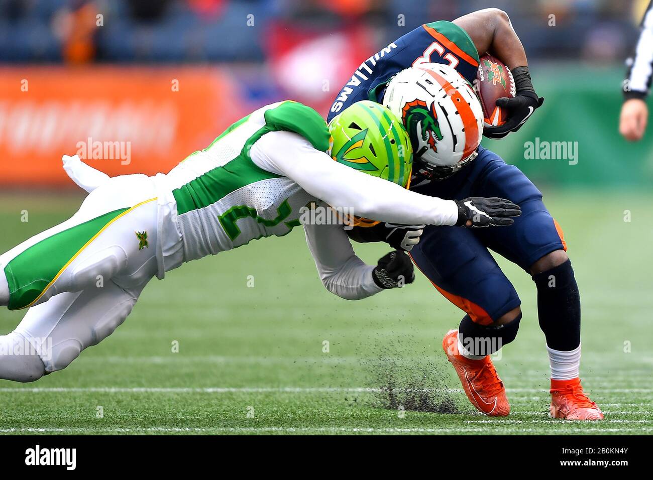 Seattle Dragons running back Trey Williams (23) is tackled by Tampa Bay ...