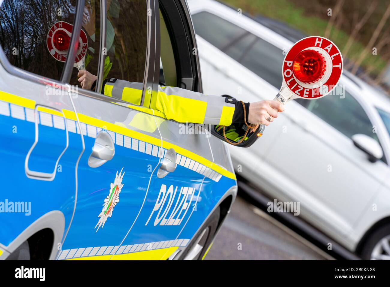 Police, holding trowel, at a traffic stop, patrol car, police control ...