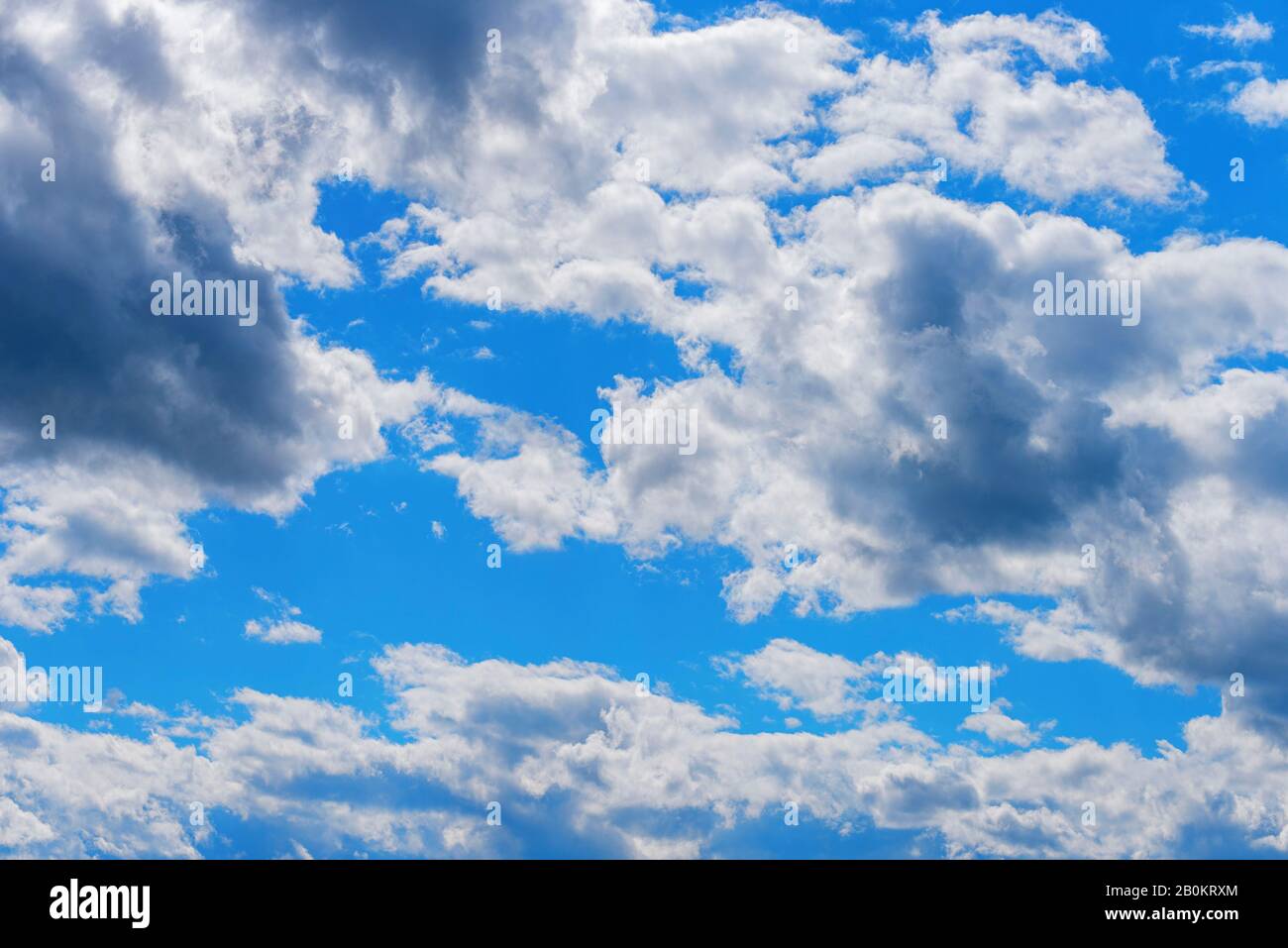 Blue sky with white fluffy clouds. Peaceful sky Stock Photo - Alamy