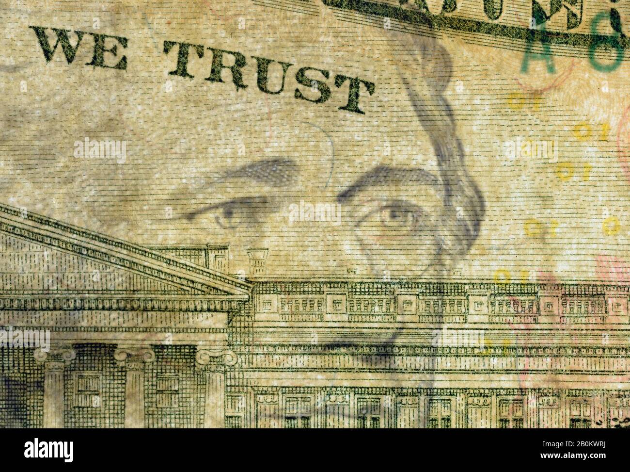 Close-up at We Trust text & president Hamilton eyes, highly magnified ...