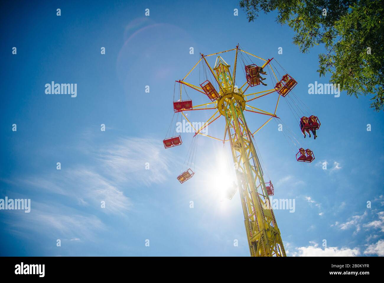 Swing Carousel Carnival Ride Set Against a Blue Sky Stock Photo - Alamy