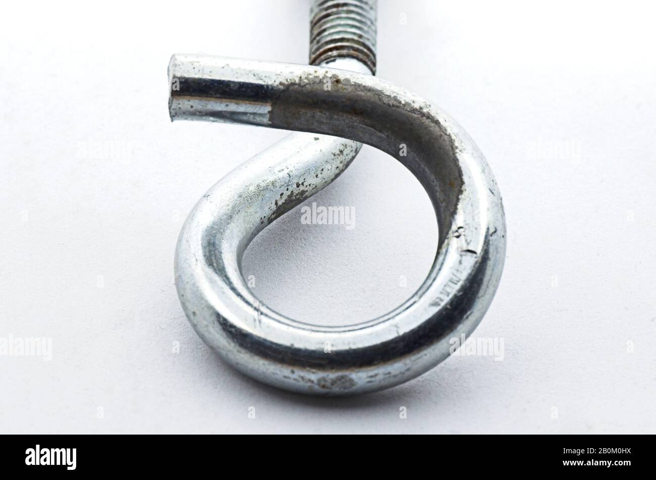 Steel pigtail screw hook on white background. Safety piece of hardware ...