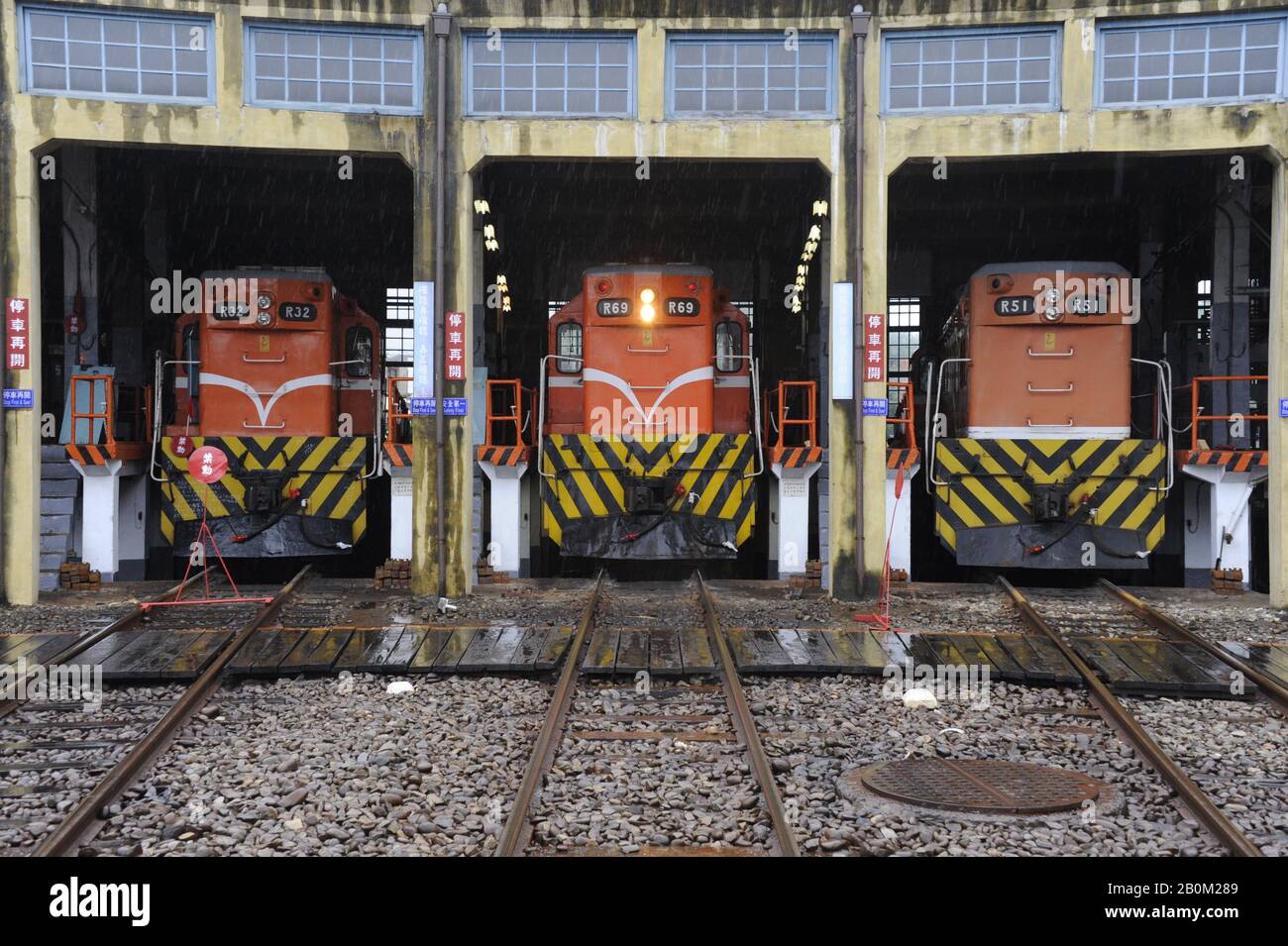 Many diesel trains parked at the locomotive roundhouse in Changhua ...