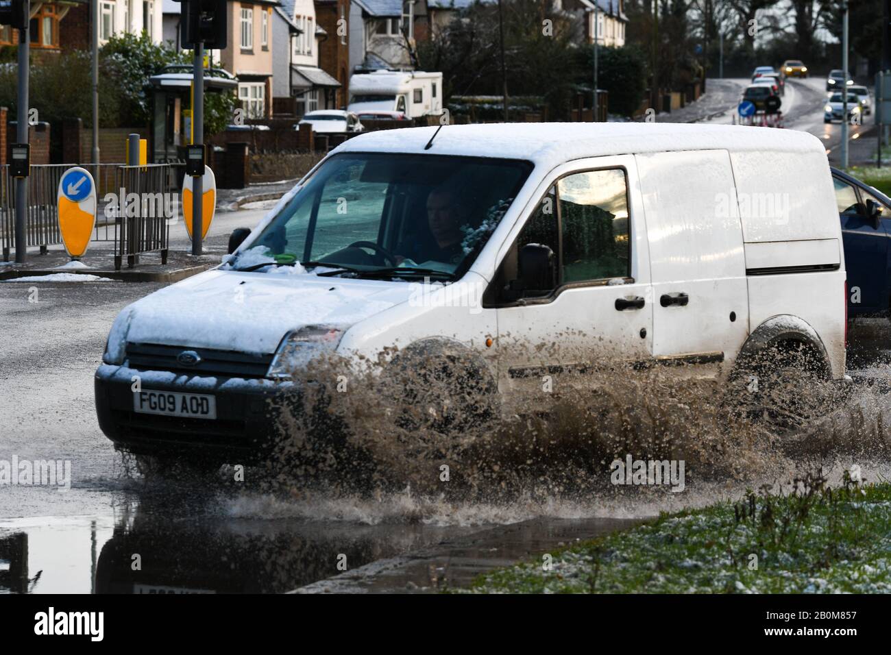 vehicle through a large puddle Stock Photo - Alamy