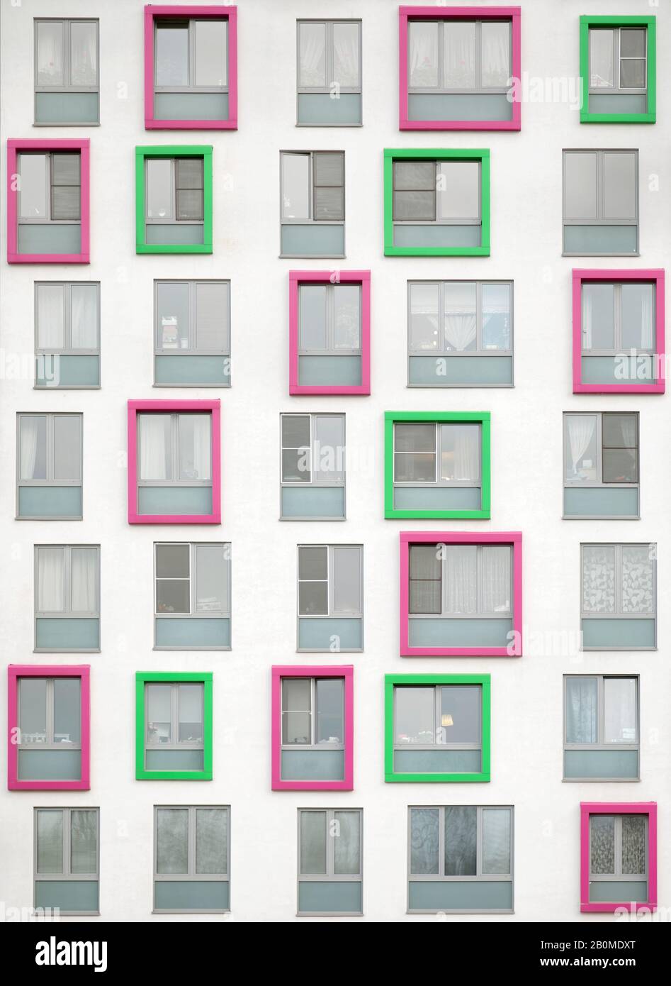 Many windows on the white facade of the residential building Stock ...