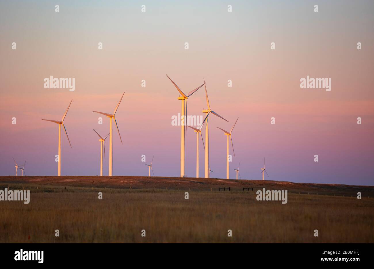 Global warming wind turbines sunset hi-res stock photography and images ...