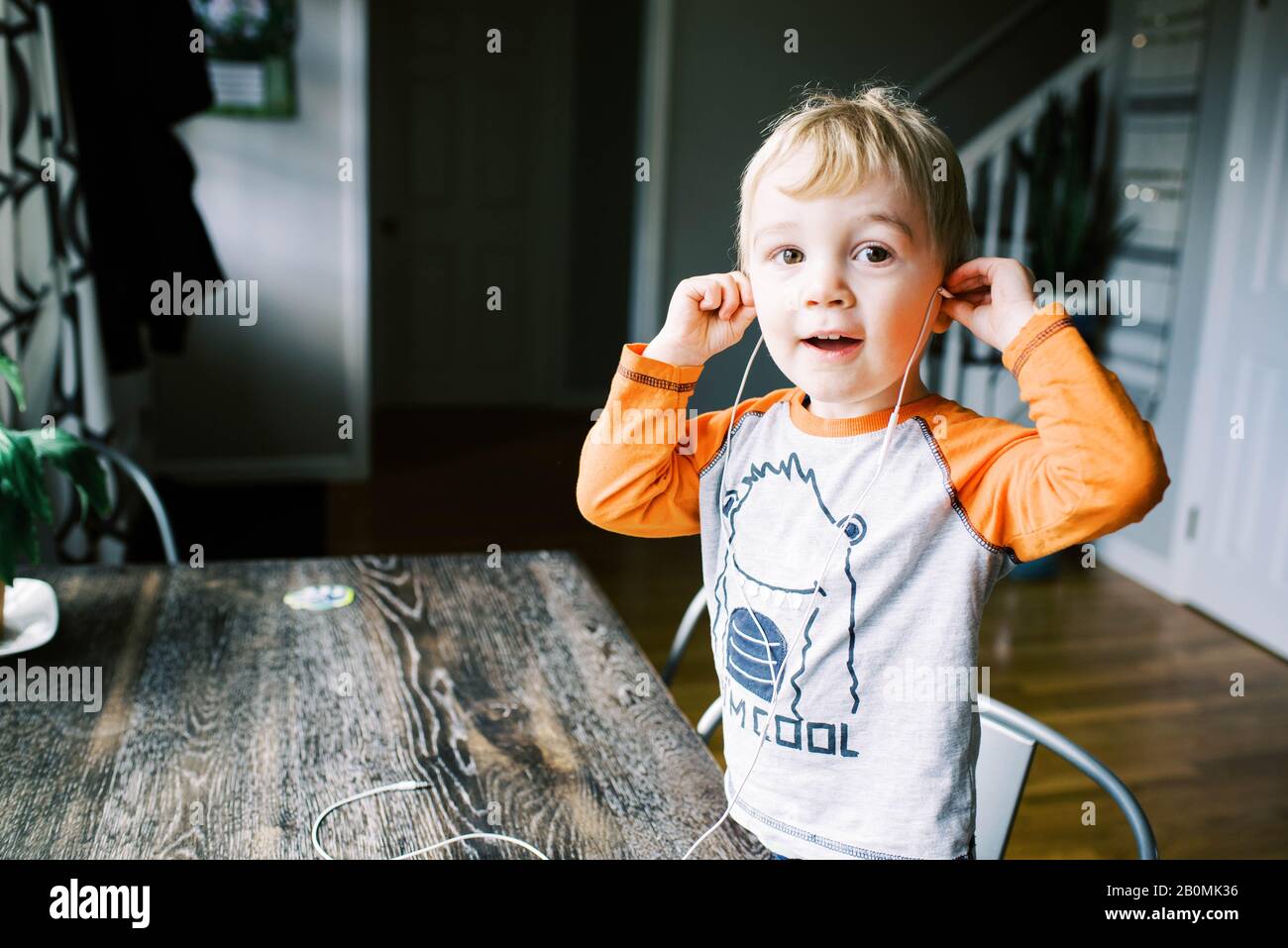 Baby listening to music hi-res stock photography and images - Alamy