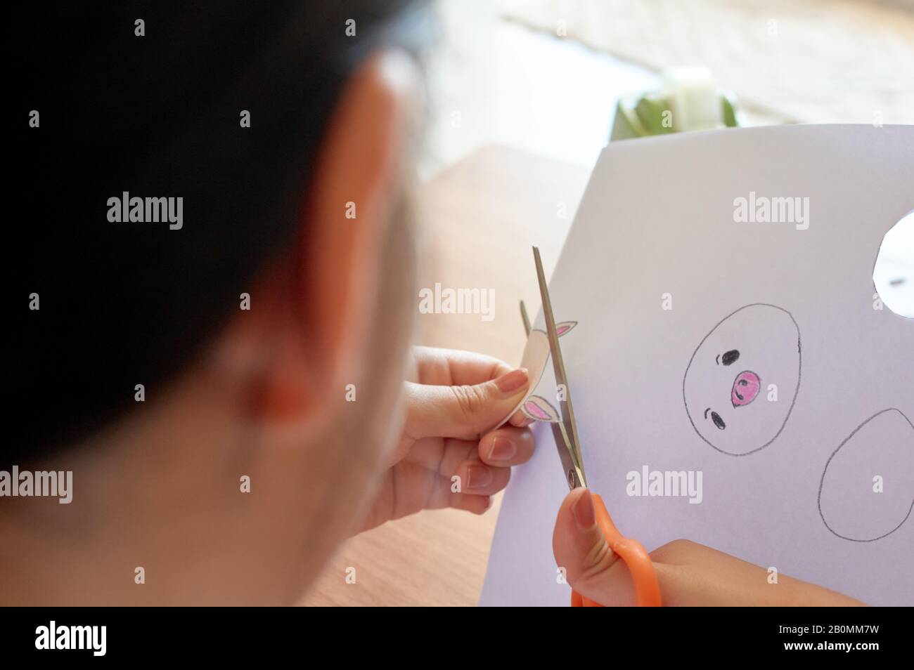 Female cutting paper scissors hi-res stock photography and images - Alamy